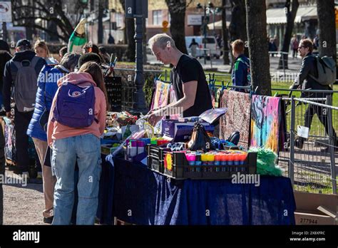Street Vendor Selling Novelty Items On May Day Eve In Esplanade Park In Helsinki Finland Stock