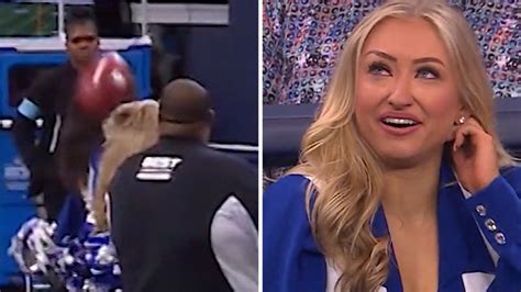 Cowboys Cheerleader Takes Football To The Head During Final Game Of Season