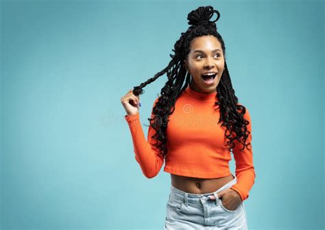 Young Lovable Woman With African Hairstyle Laughing During Indoor