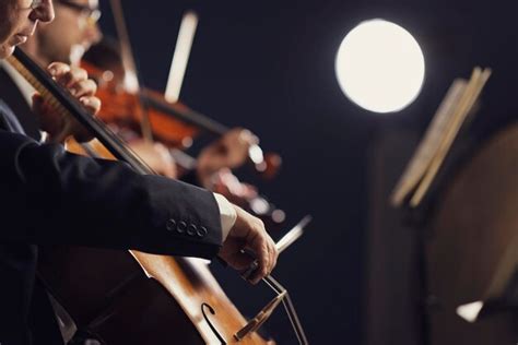 Premium Photo Symphonic Orchestra Performing On Stage And Playing A Classical Music Concert