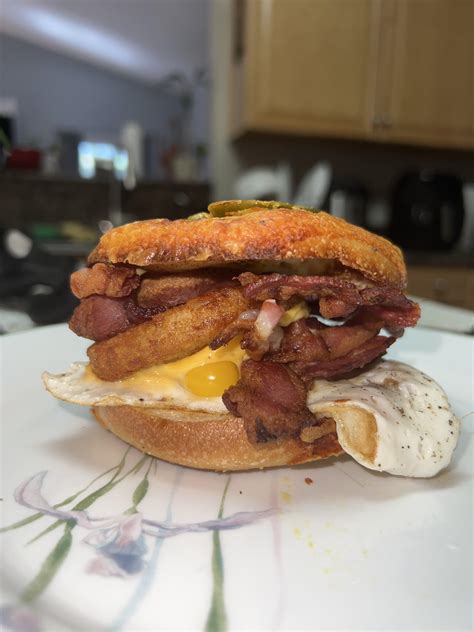 Cheddar Jalapeño Bagel With A Runny Fried Egg Bacon Hash Brown And