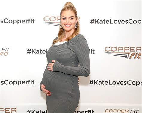 Pregnant Kate Upton Cradles Her Growing Belly Bump Is Out