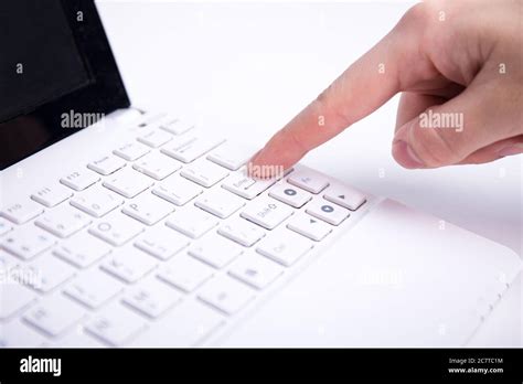 Female Hand Pushing Enter Button On White Laptop Keyboard Stock Photo Alamy