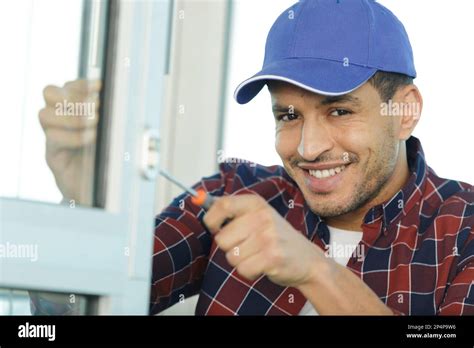 Man Screws A Pvc Window Stock Photo Alamy