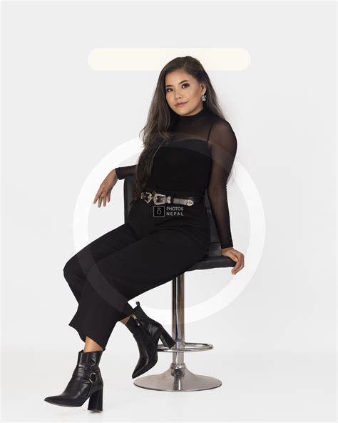 Confident Nepali Fashion Model Smiling In Black Outfit And Boots