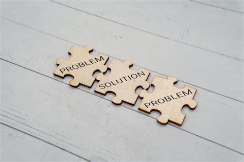 Three Wooden Jigsaw Puzzle Pieces With Text Problem And Solution Stock