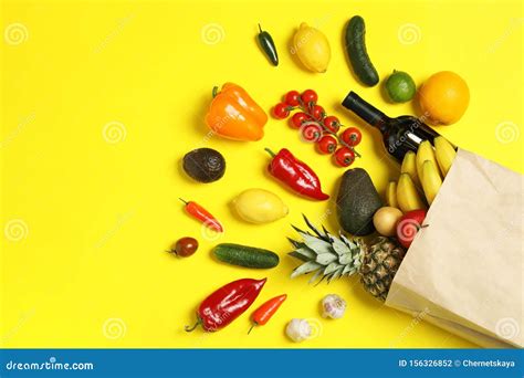 Shopping Paper Bag With Different Groceries On Yellow Background Flat