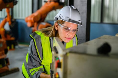 Female Engineer Worker Working With Robotic Machine Automation Stock