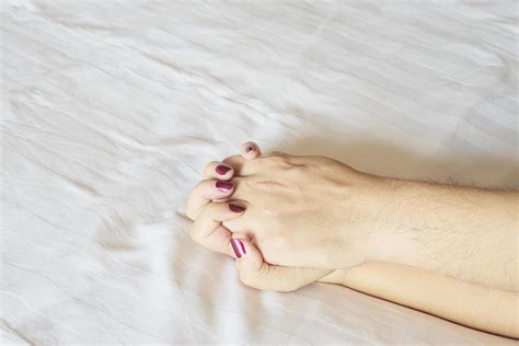 Man Holding Woman Hand On White Bed Couple Sexual Concept 9297867 Stock Photo At Vecteezy