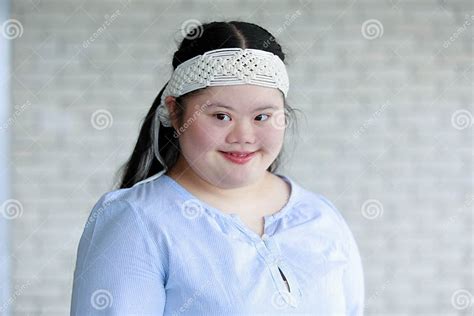 Portrait Close Up Shot Of Asian Young Happy Chubby Down Syndrome