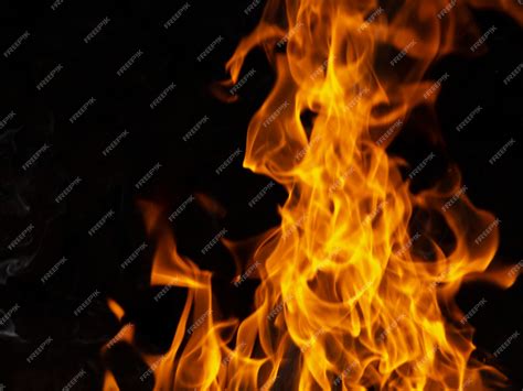 Premium Photo Moving Flames On Black Background