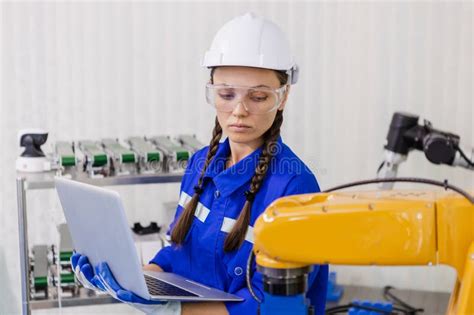 female engineer using tablet checking system robot arm automate