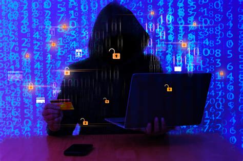 hooded computer hacker in cybersecurity vulnerability log4j on server