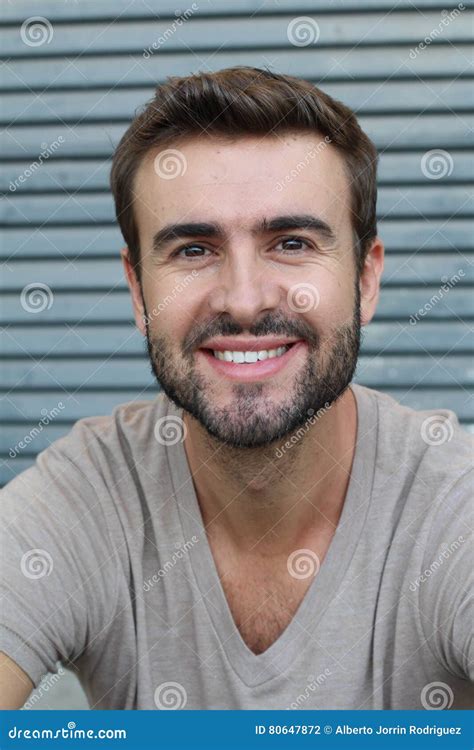 Portrait Of Good Looking Smiling Bearded Man With Perfect White Teeth