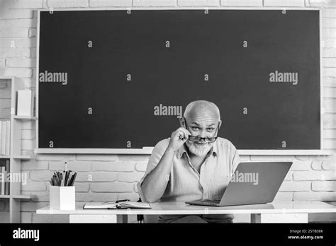 Working As Teacher Smiling Male Teacher In His Classroom Smiling Man