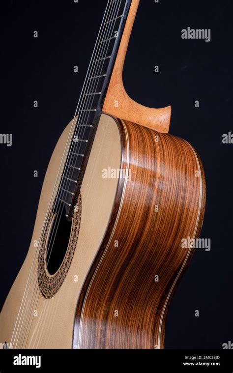 Classical Guitar Top Isolated On Black Background With A Beautiful