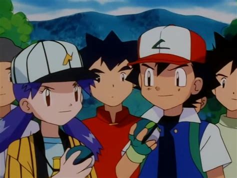 Ash And Casey Holding Their Respective Sport Balls By