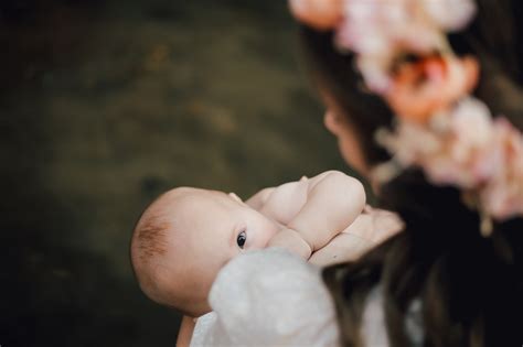 An Intimate Breastfeeding Session In The Creek The Bond Between Mother
