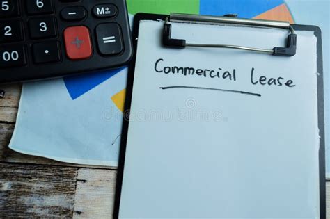 Concept Of Commercial Lease Write On Paperwork Isolated On Wooden Background Stock Image Image