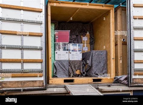 Household Items Furniture And Boxes Packed Into Lorry Storage Container For Moving House Uk