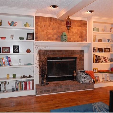 custom bookshelves flanking a fireplace by designtime llc
