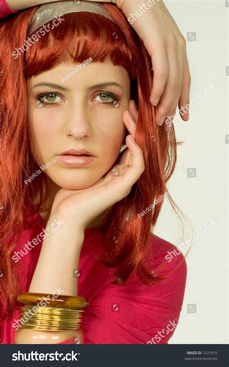 Retro Redhead Beautiful Model With Retro Make Up Hairdo And Outfit Stock Photo
