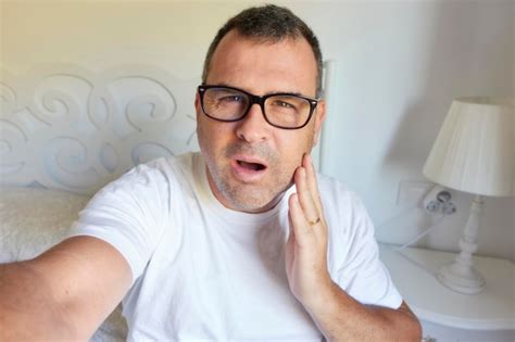 Premium Photo A Man With Phlegmon From A Tooth Root Infection Who