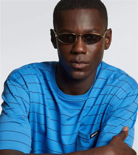 Miu Miu Logo Oval Sunglasses In Gold Miu Miu Mytheresa