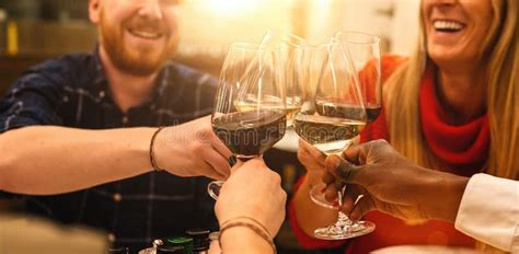 Happy Friends Clinking Glasses For Smiling And Toasting Wine In Italian