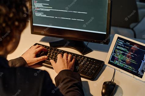 premium photo programmer typing codes on computer for new software