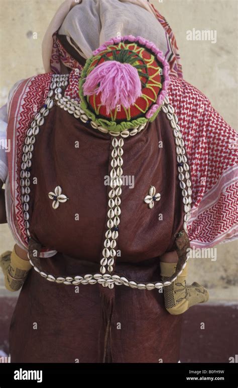 Eritrea Mother Carrying Baby In Traditional Leather Baby Carrier Decorated With Cowrie Shells