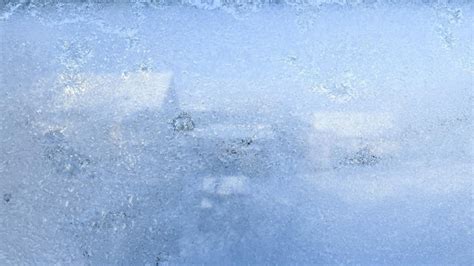 Premium Photo Frozen Window Beautiful Snowflakes On The Window