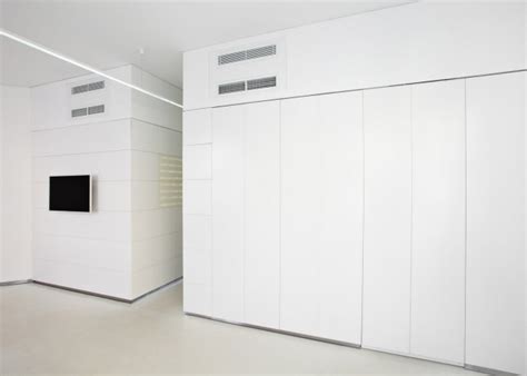 Fluid Architecture Adds Secret Doors Inside Serbian Clinic