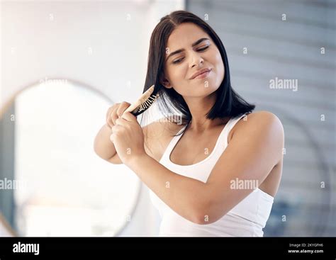 Hair Brush And Split Ends With A Woman In The Bathroom Of Her Home Brushing Her Knots For