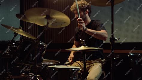 Premium Photo Rock Musician Hitting Drum Cymbals In Concert Hall