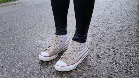J Black Leggings And Converse While Walking Female Omorashi
