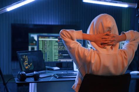 Looking At Screens Young Professional Female Hacker Is Indoors By Computer With Lot Of