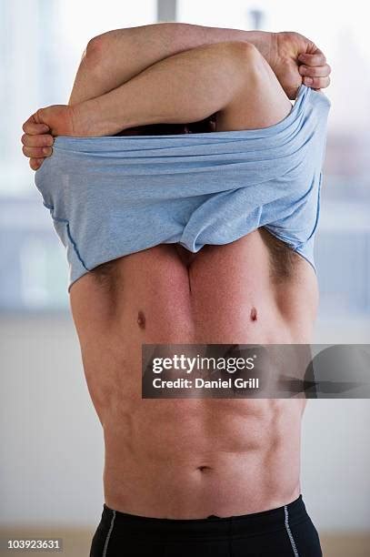 Man Shirt Off Muscles Photos And Premium High Res Pictures Getty Images