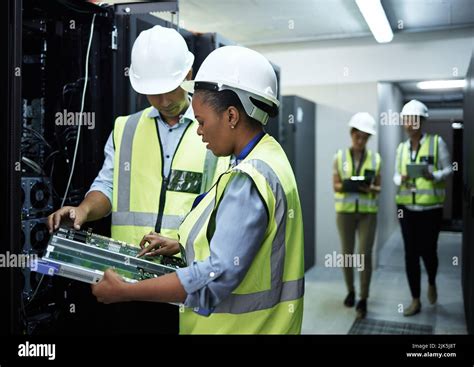 Technology Doctors A Group Of Computer Programmers Working In A Server