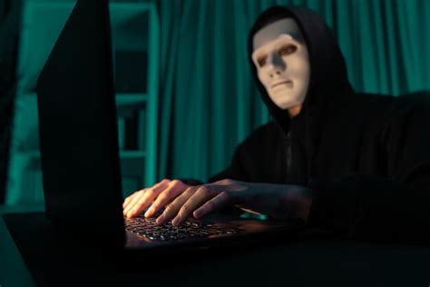 Premium Photo White Criminal Anonymous Mask Installing Coding