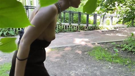 The Girl Topless Is Walking In The Park In Public