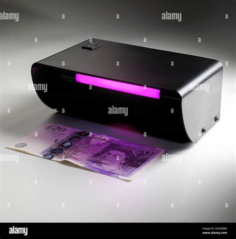 Counterfeit Detection An Ultraviolet Lamp Used To Detect Counterfeit Bank Notes Banknotes