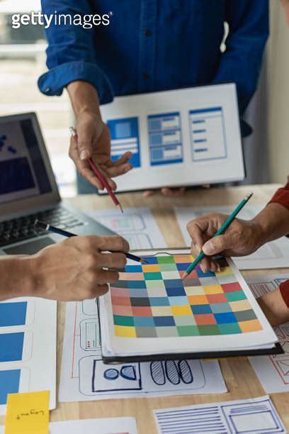 the web ux ui design team is writing code and layers to customize the smartphone front ux ui