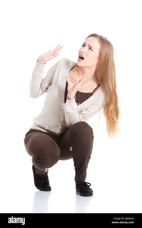 Woman Crouching In Fear