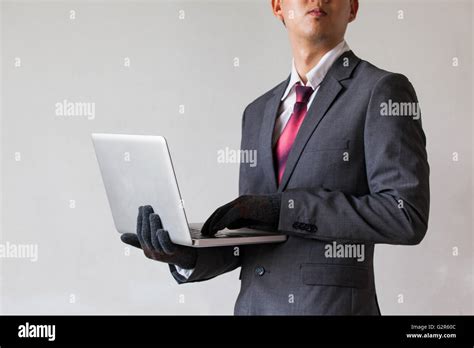 Business Man Wearing Gloves And Using Computer Fraud Hacker Theft Cyber Crime Concept Stock