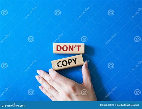 dont copy symbol wooden blocks with words dont copy beautiful blue