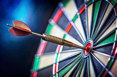 A Dart Arrow That Hits The Target Center Of The Dartboard Premium AI Generated Image