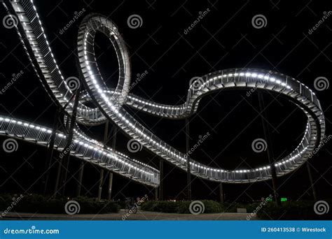 Tiger And Turtle People As Silhouettes On The Stairs Of The Walkable