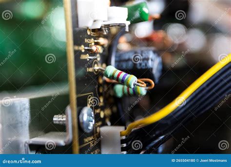 A Portrait Of Some Resistors On A Black Circuit Board In An Open