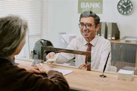 Bank Teller Smiling While Helping Customer Stock Image Image Of Counter Work 371626367